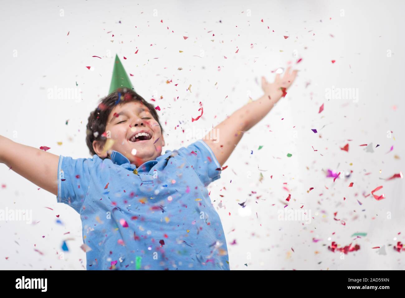 kid blowing confetti Stock Photo - Alamy