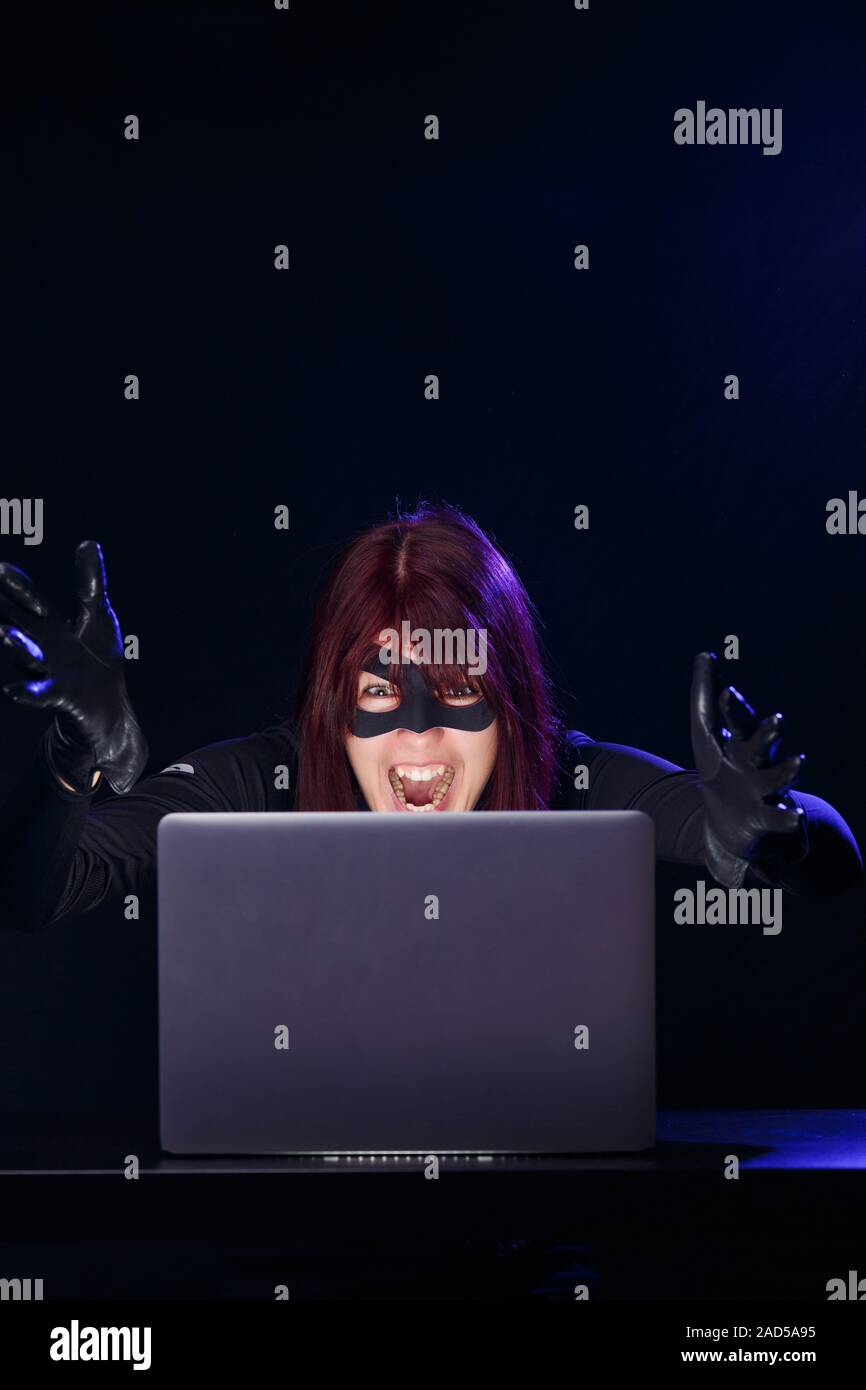 Portrait of hacker with computer Stock Photo - Alamy
