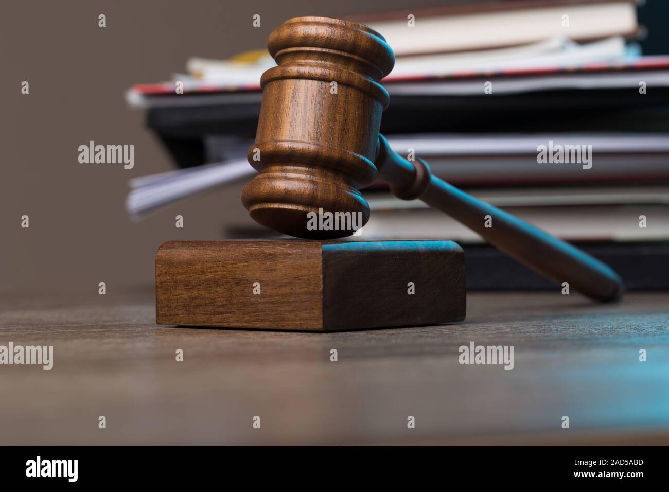 Hammer of judge against folder Stock Photo - Alamy