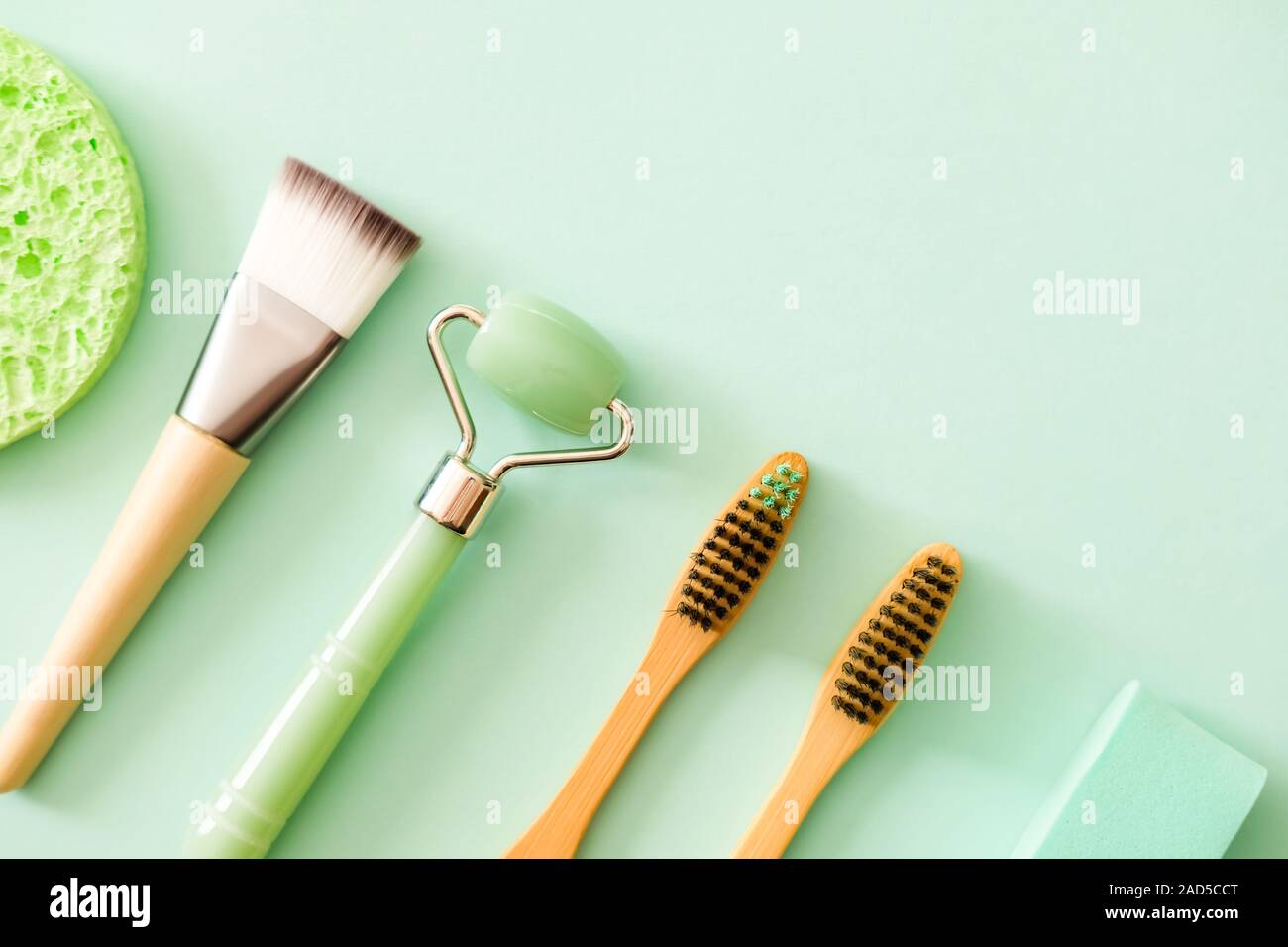Self care tools green background Stock Photo - Alamy