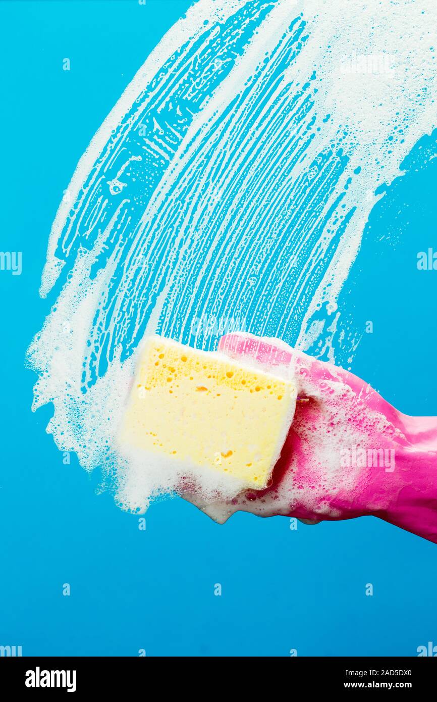 Man washes window with sponge Stock Photo - Alamy