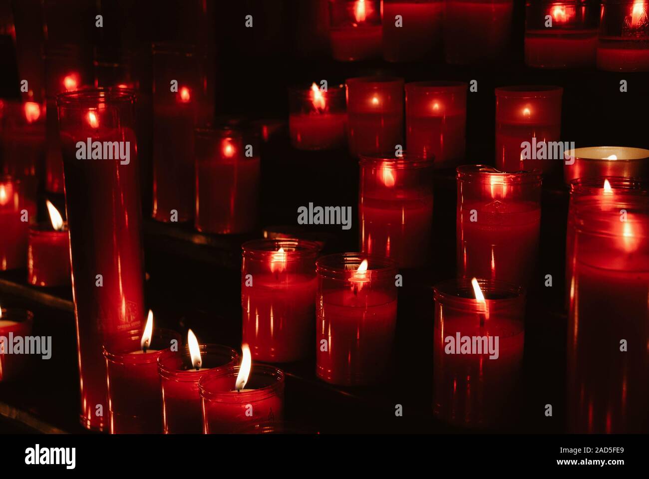 Red candles inside a church Stock Photo - Alamy