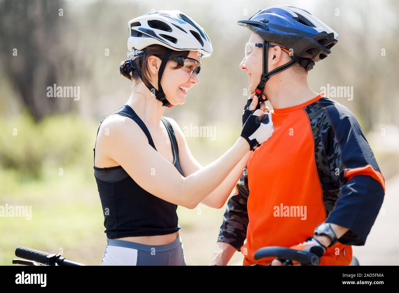 Two athletes wear bicycle helmets Stock Photo - Alamy