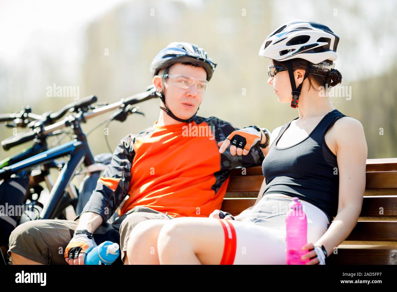 Two athletes in bicycle helmets Stock Photo - Alamy