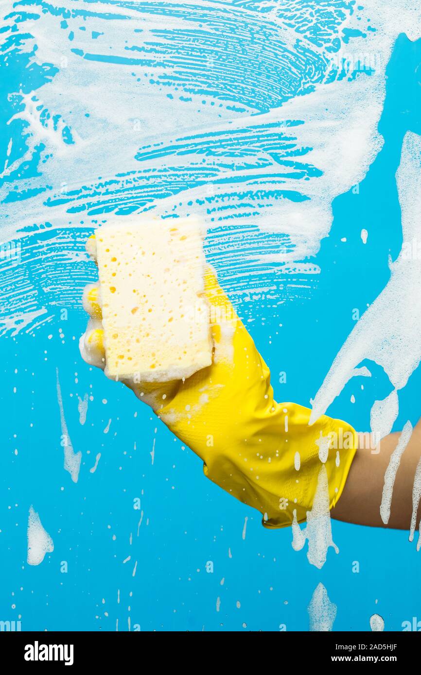Man washes window with sponge Stock Photo - Alamy