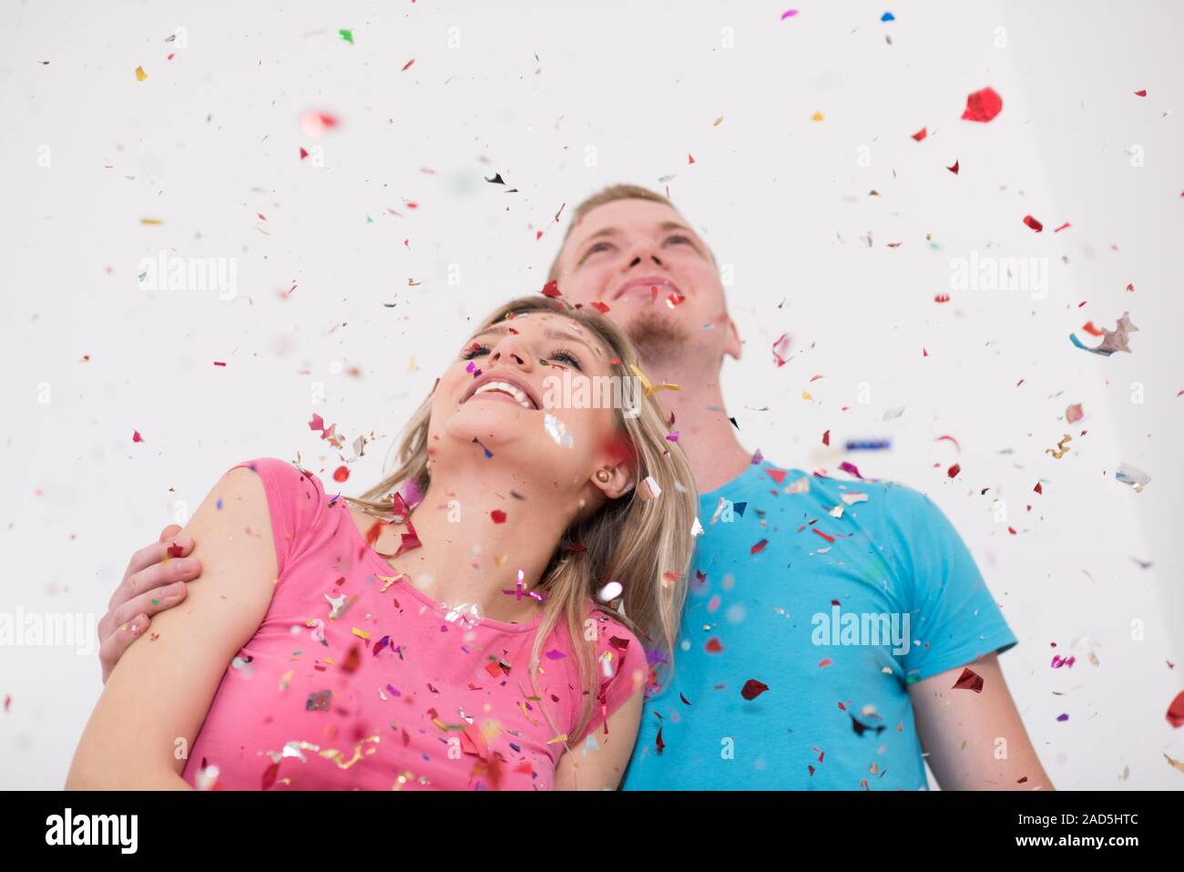 romantic young couple celebrating party with confetti Stock Photo - Alamy