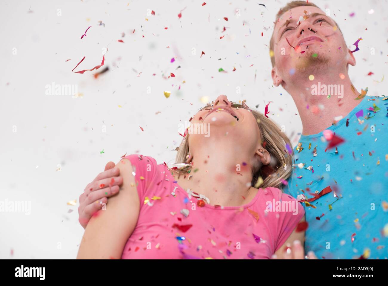 romantic young couple celebrating party with confetti Stock Photo - Alamy