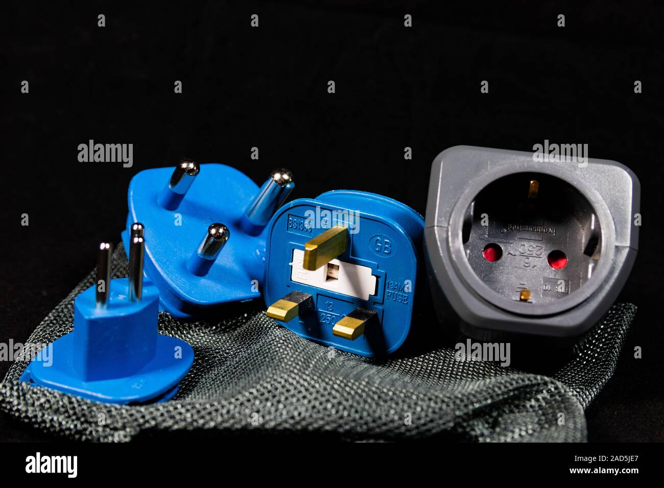 Netherlands - December 1 2019: Travel adapter set on black background ...