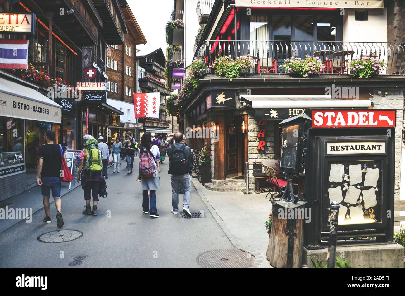 Zermatt, Switzerland - July 10, 2019: Street with tourists in beautiful ...