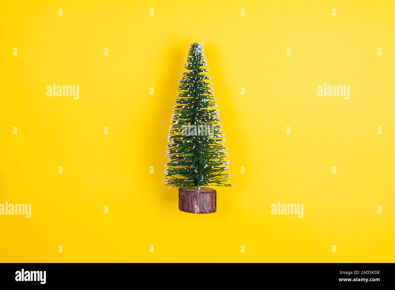 Christmas tree object on a yellow background Stock Photo - Alamy