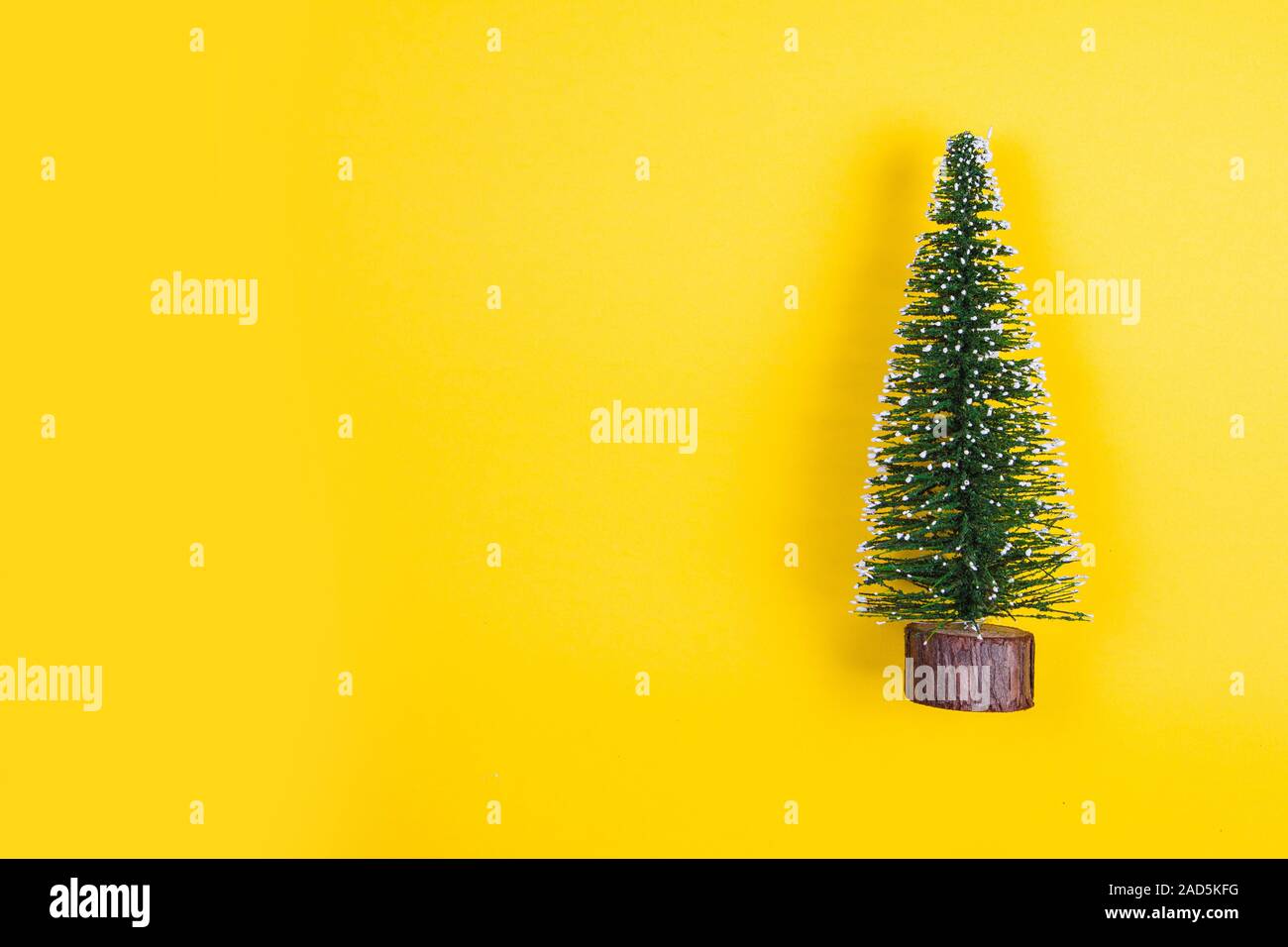 Christmas tree object on a yellow background Stock Photo - Alamy