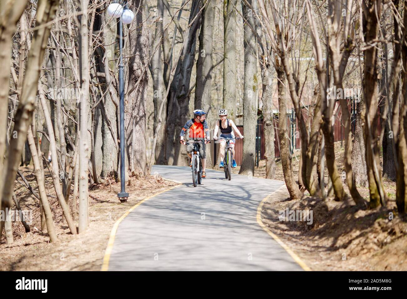 Cyclists in helmets for walk Stock Photo - Alamy