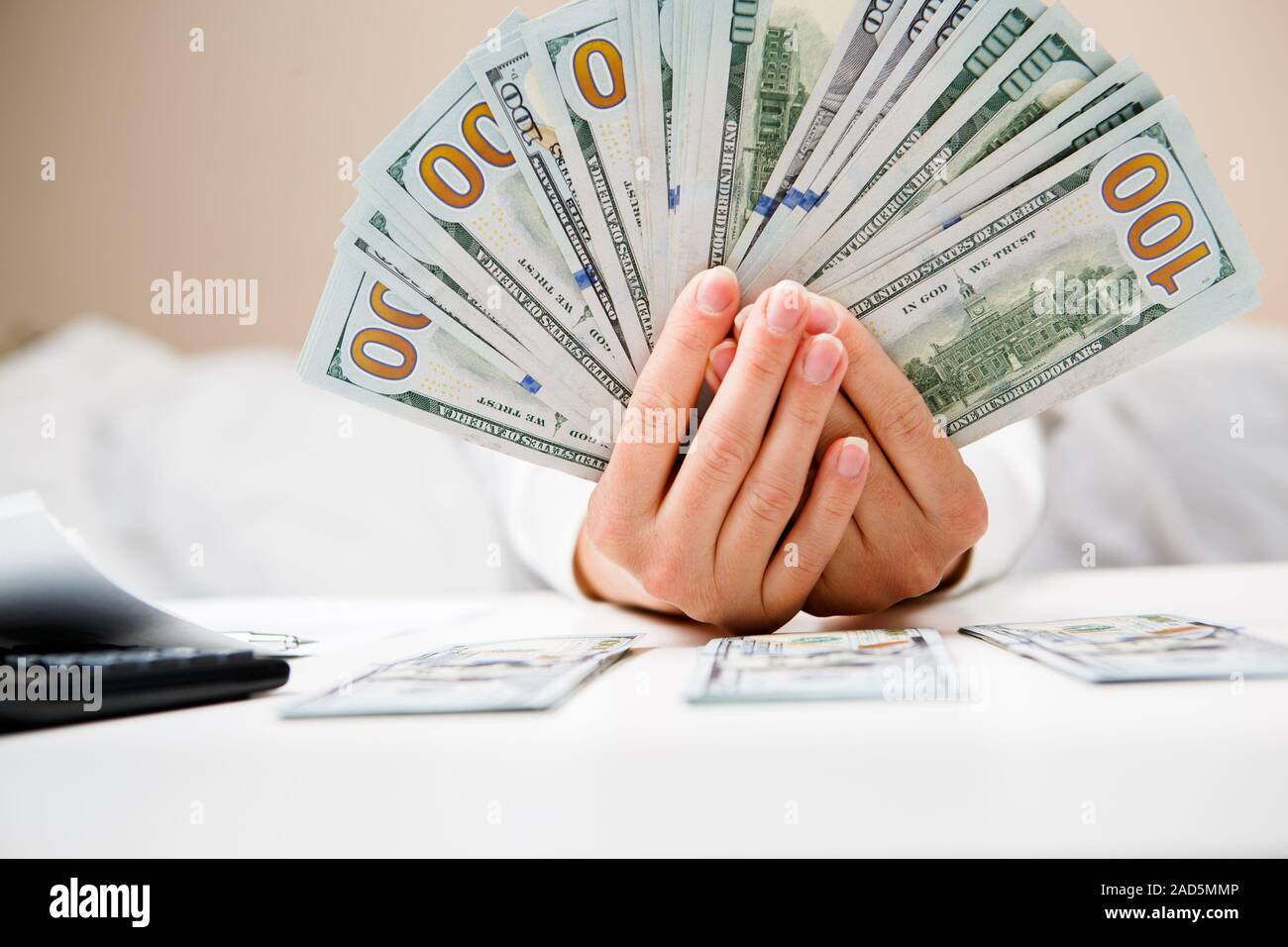 Counting hundred dollar bills table hi-res stock photography and images ...