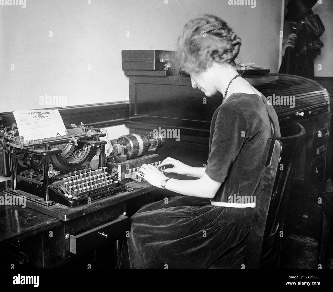 Encryption machine. A woman using an electric code machine for ... Encryption machine. A woman using an electric code machine for ...