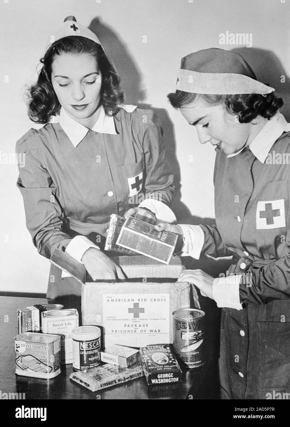 Red Cross workers packing parcels for prisoners of war in 1942. Red ...