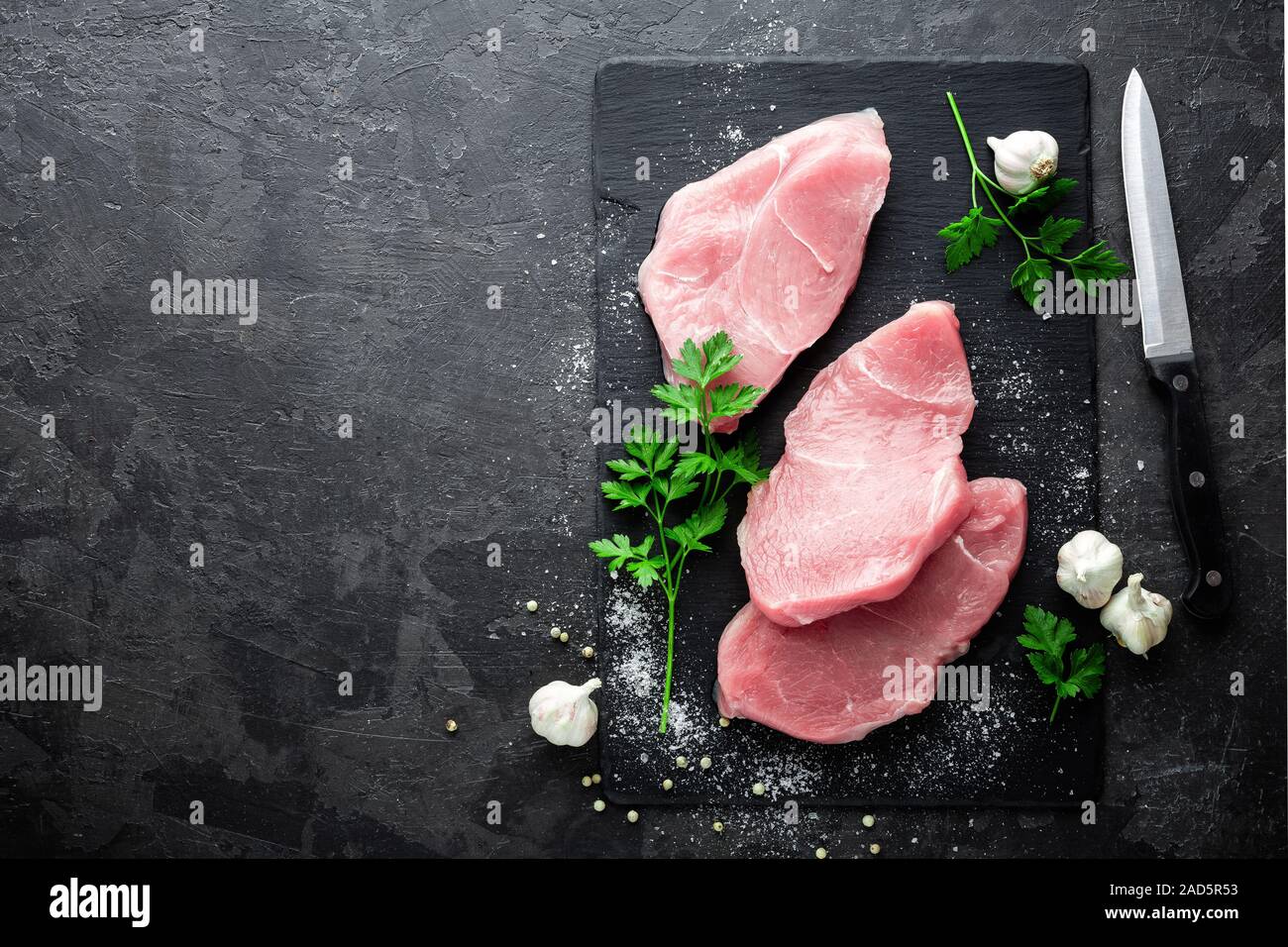Raw meat, beef steak on black background, top view Stock Photo - Alamy