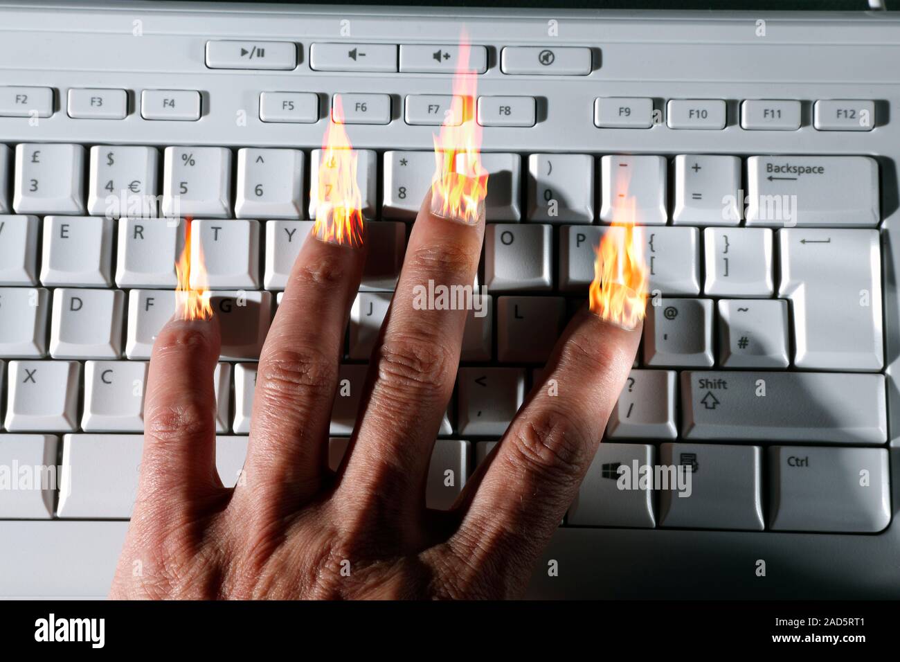 Internet aggression. Conceptual image of flames rising from the hands ...