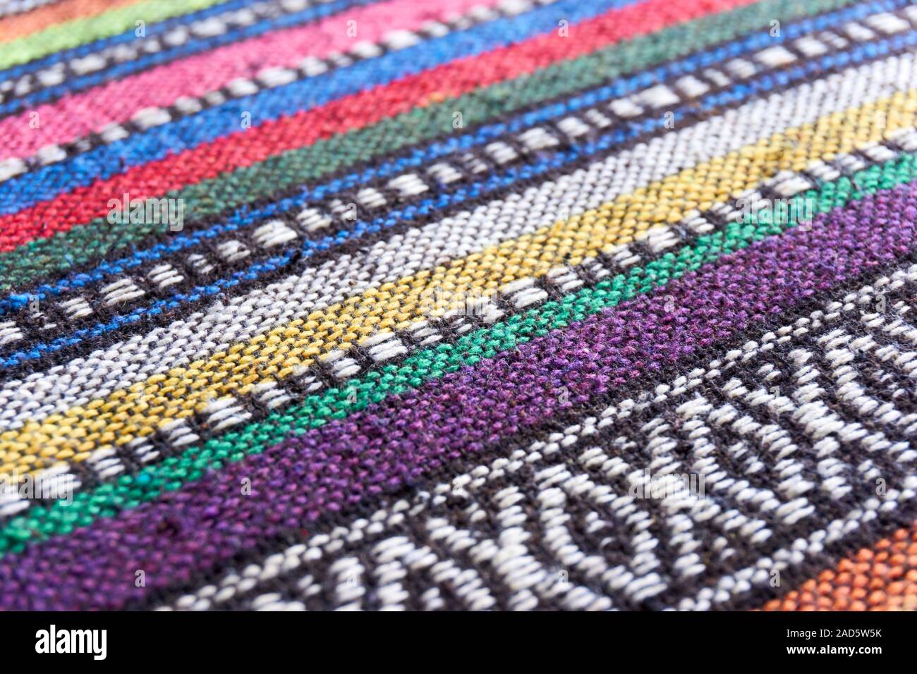 Woven fabric background with colorful geometric pattern Stock Photo - Alamy