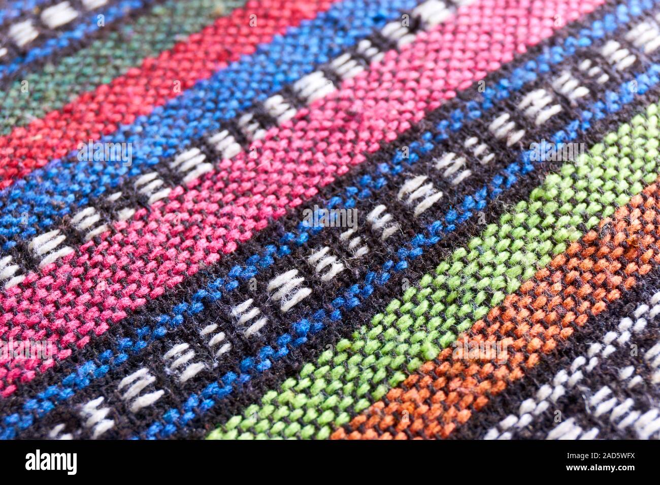 Woven fabric background with colorful geometric pattern Stock Photo - Alamy