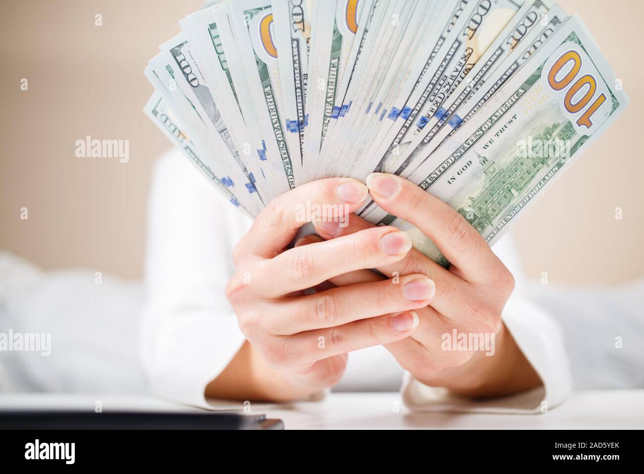 Hand holding money dollars Stock Photo - Alamy