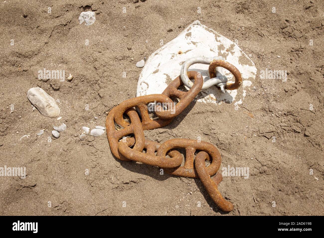 large chain anchor point buried into the beach Stock Photo - Alamy