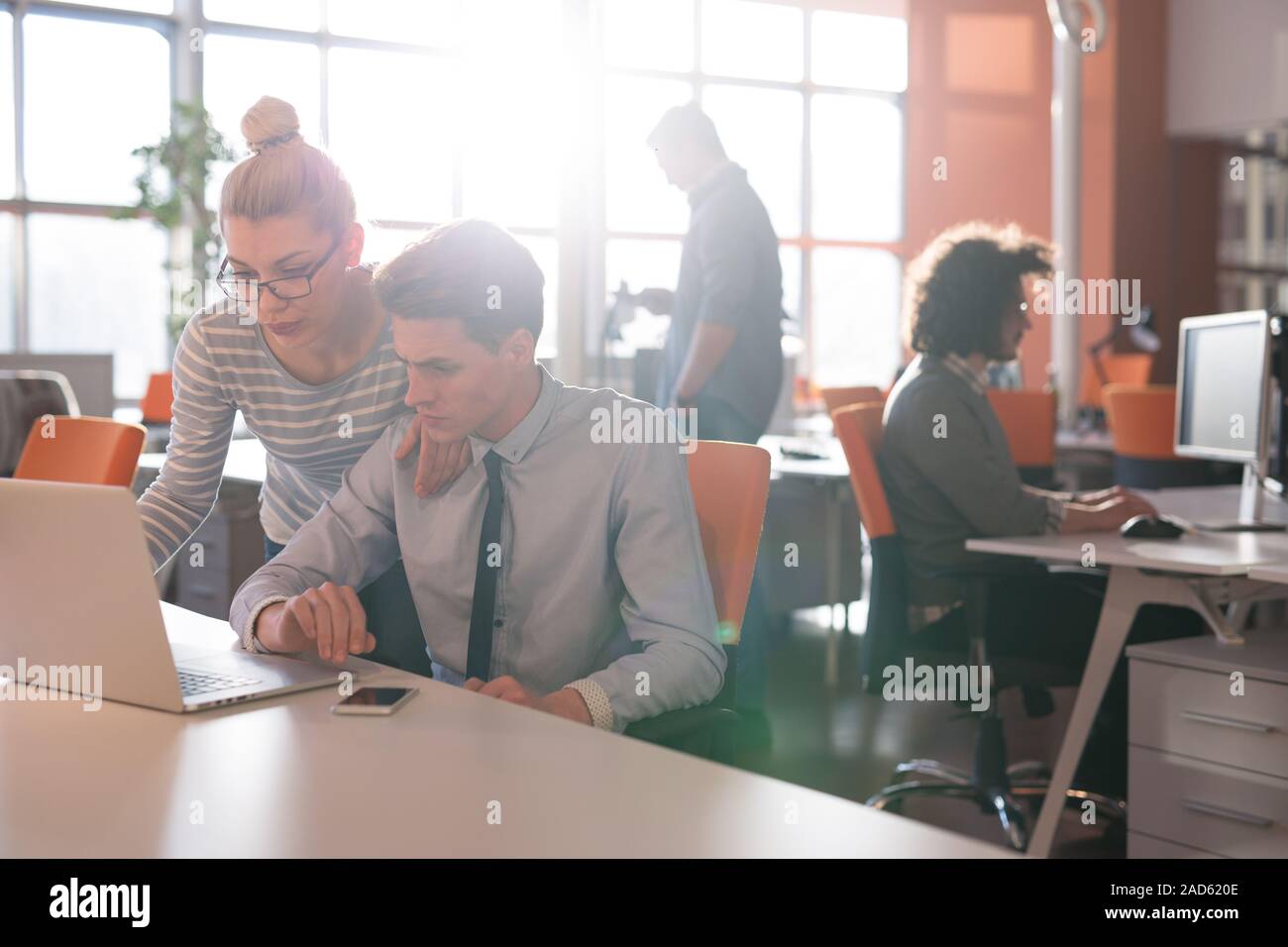 Two Business People Working With laptop in office Stock Photo - Alamy