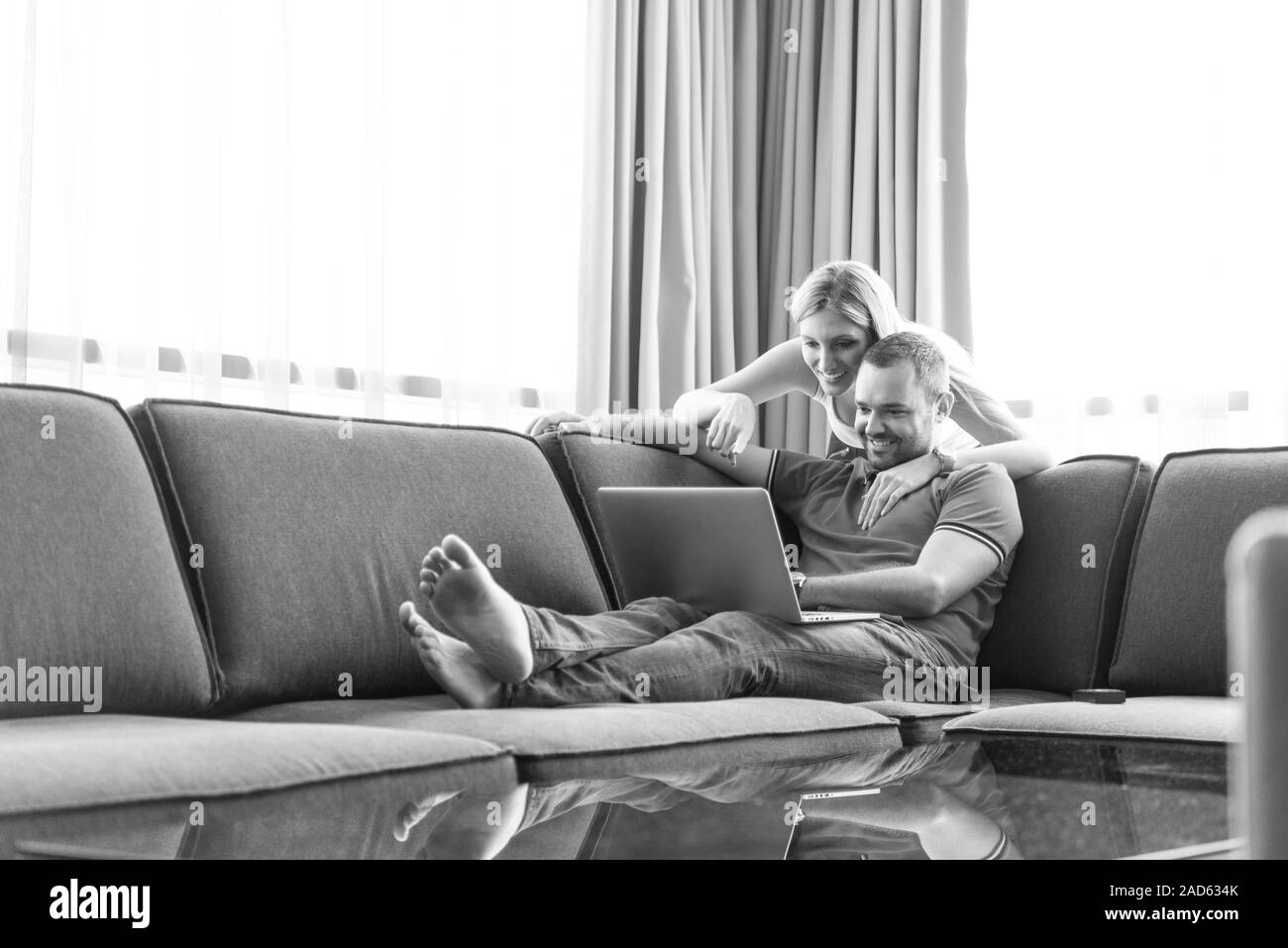 Couple using computer home Black and White Stock Photos & Images - Alamy