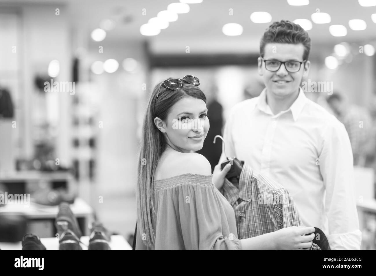 couple in Clothing Store Stock Photo - Alamy