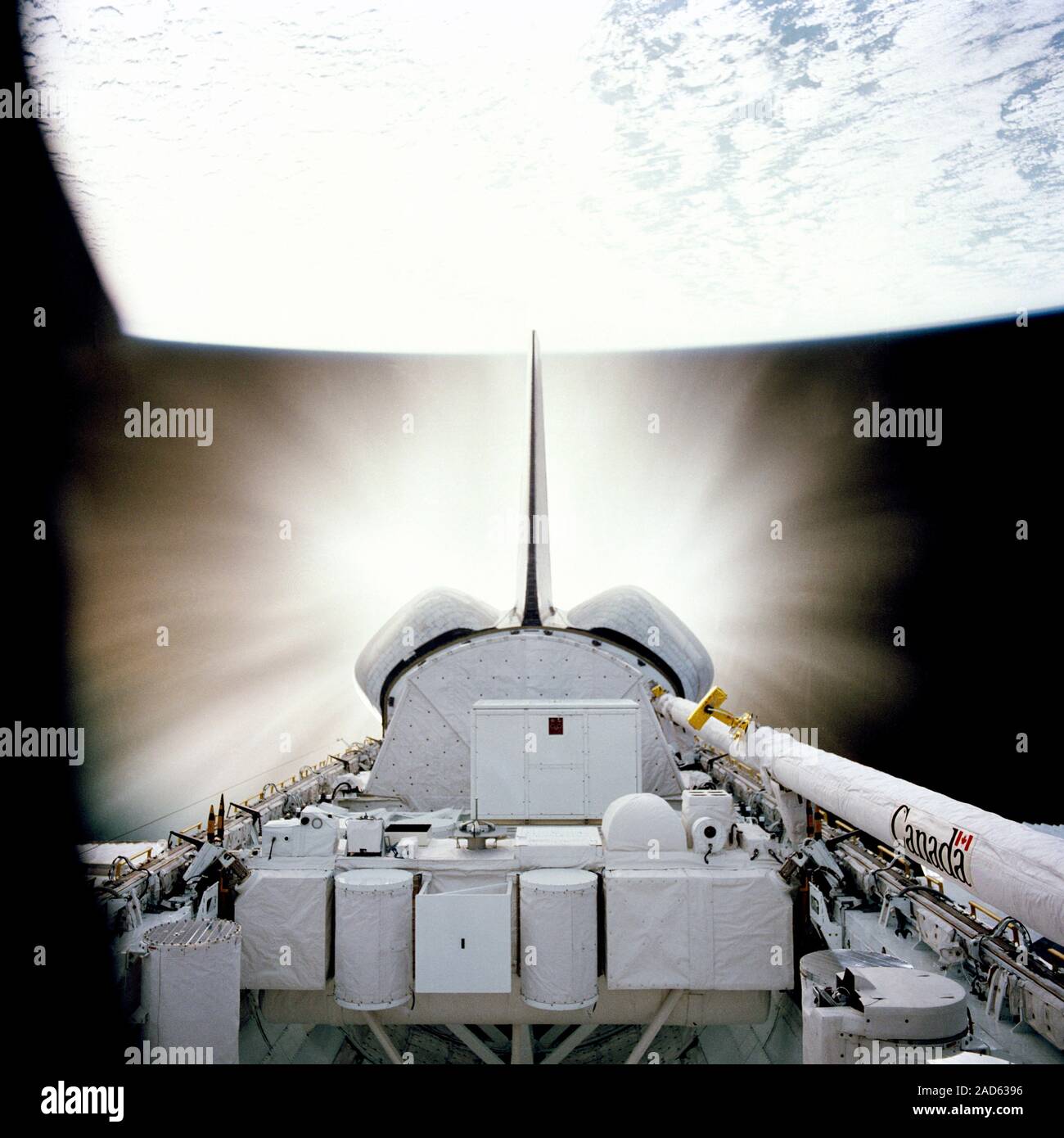 An Orbital Maneuvering System (OMS) engine firing on the Space Shuttle ...