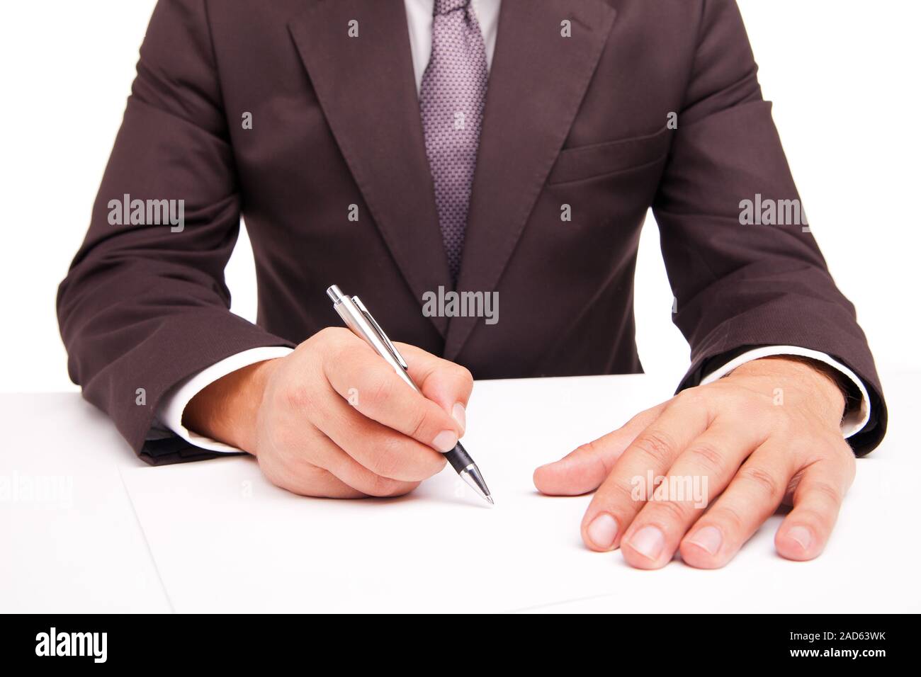 Business worker signing the contract on white Stock Photo - Alamy