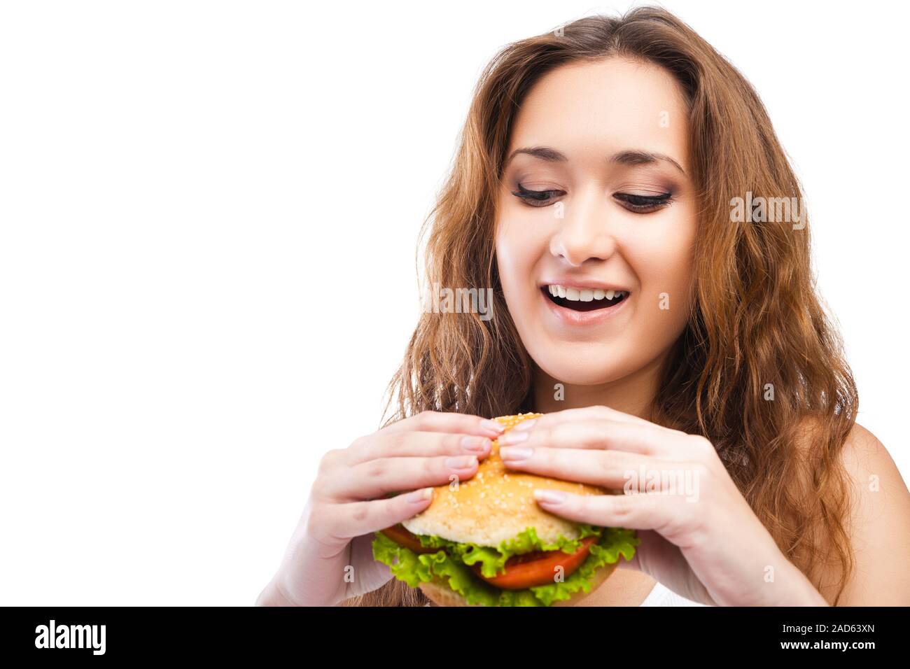 Happy Young Woman Eating big yummy Burger isolated Stock Photo - Alamy