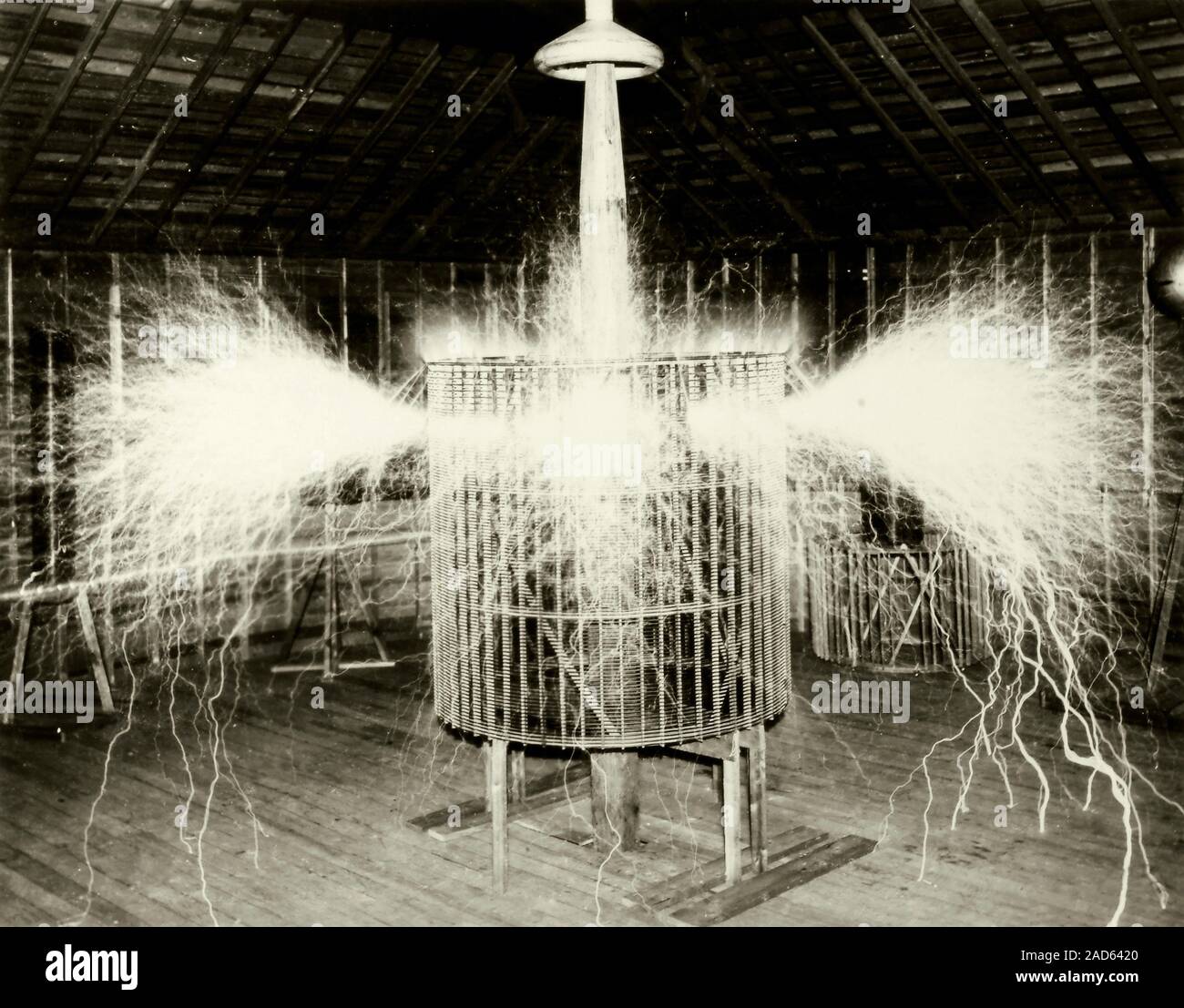 Tesla coil experiment. Electrical streamers sparking outwards from a ...