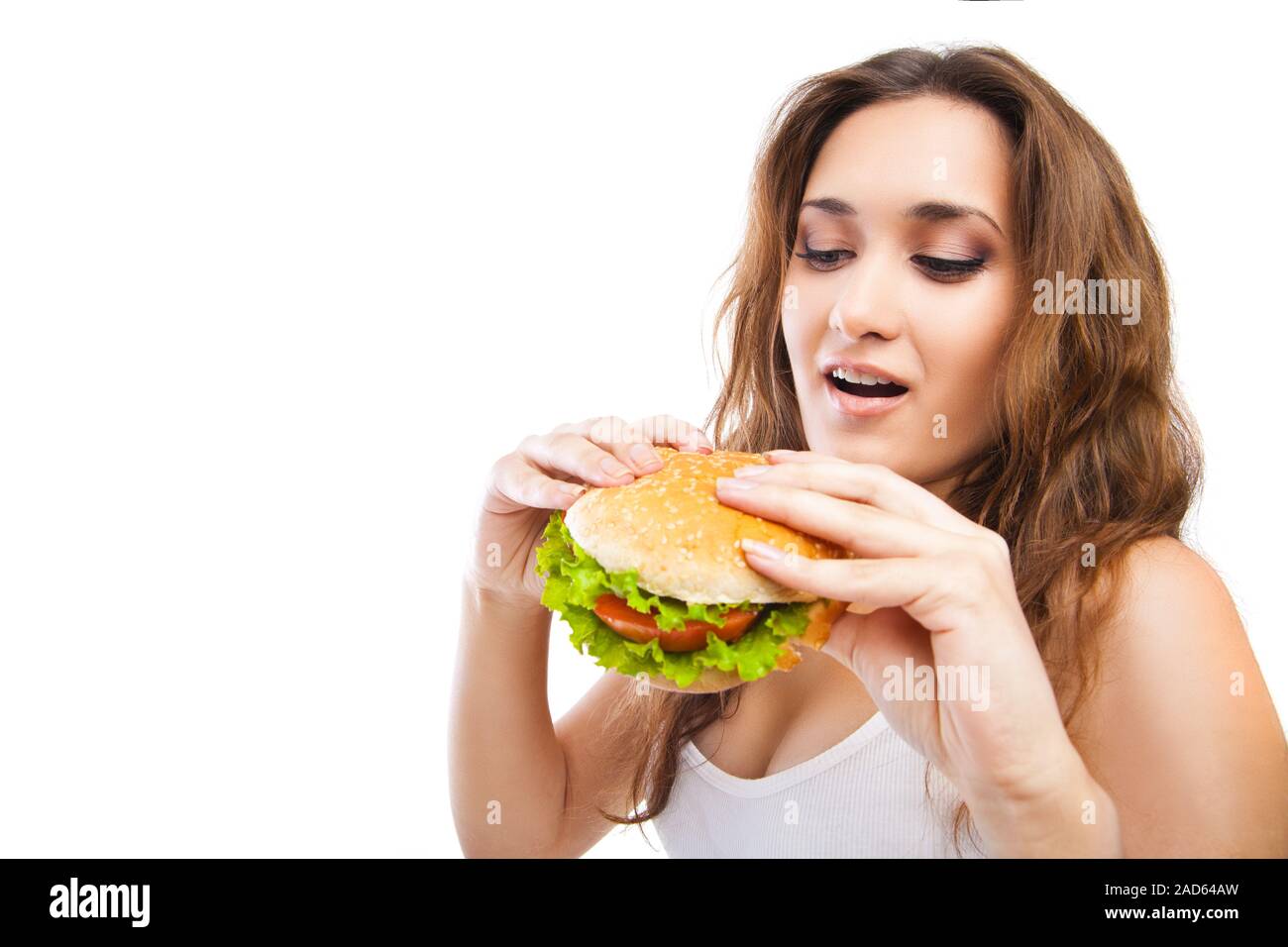 Happy Young Woman Eating big yummy Burger isolated Stock Photo - Alamy