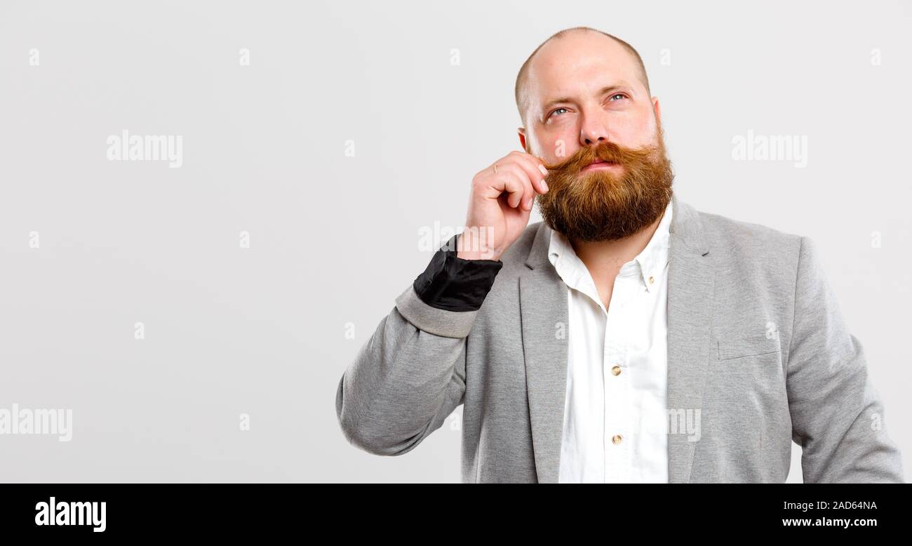 Bald man holds his mustache Stock Photo - Alamy