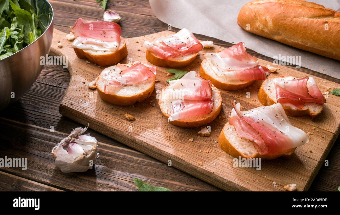 Wooden cutting board with bacon Stock Photo - Alamy