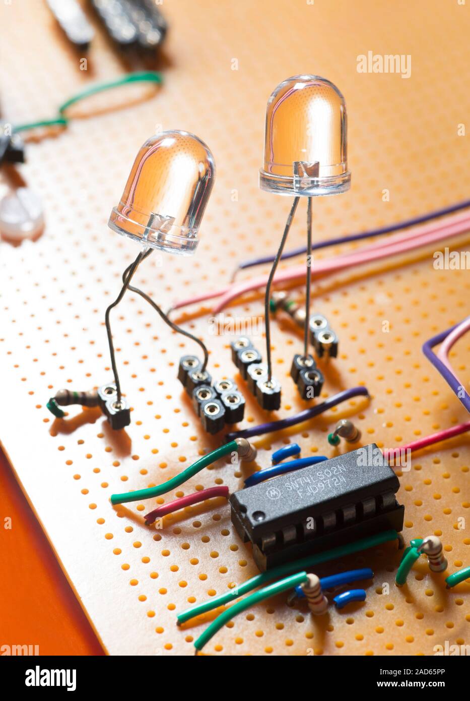 LEDs, electronic components and wires assembled on a circuit board ...