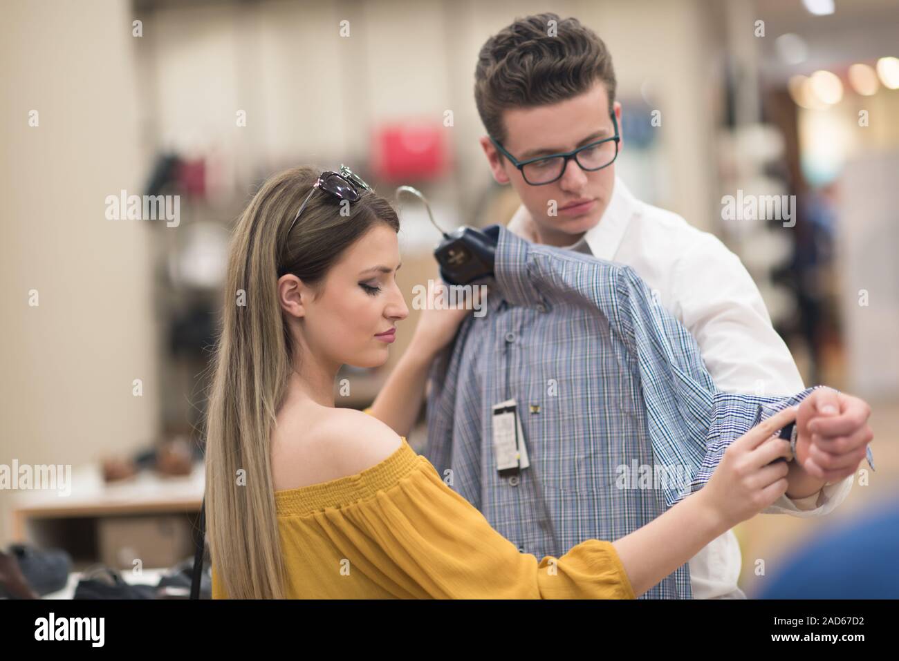 couple in Clothing Store Stock Photo - Alamy