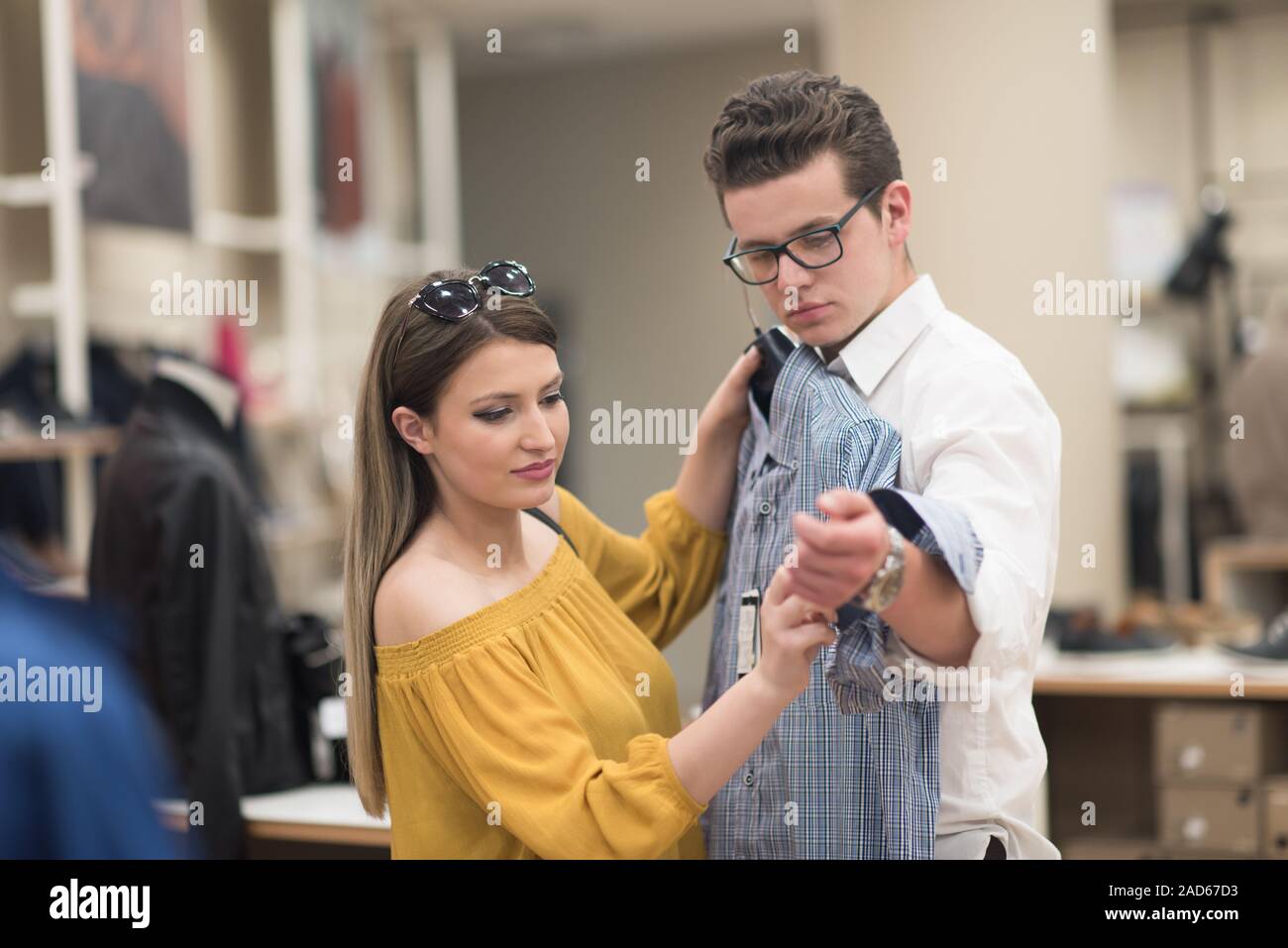 couple in Clothing Store Stock Photo - Alamy