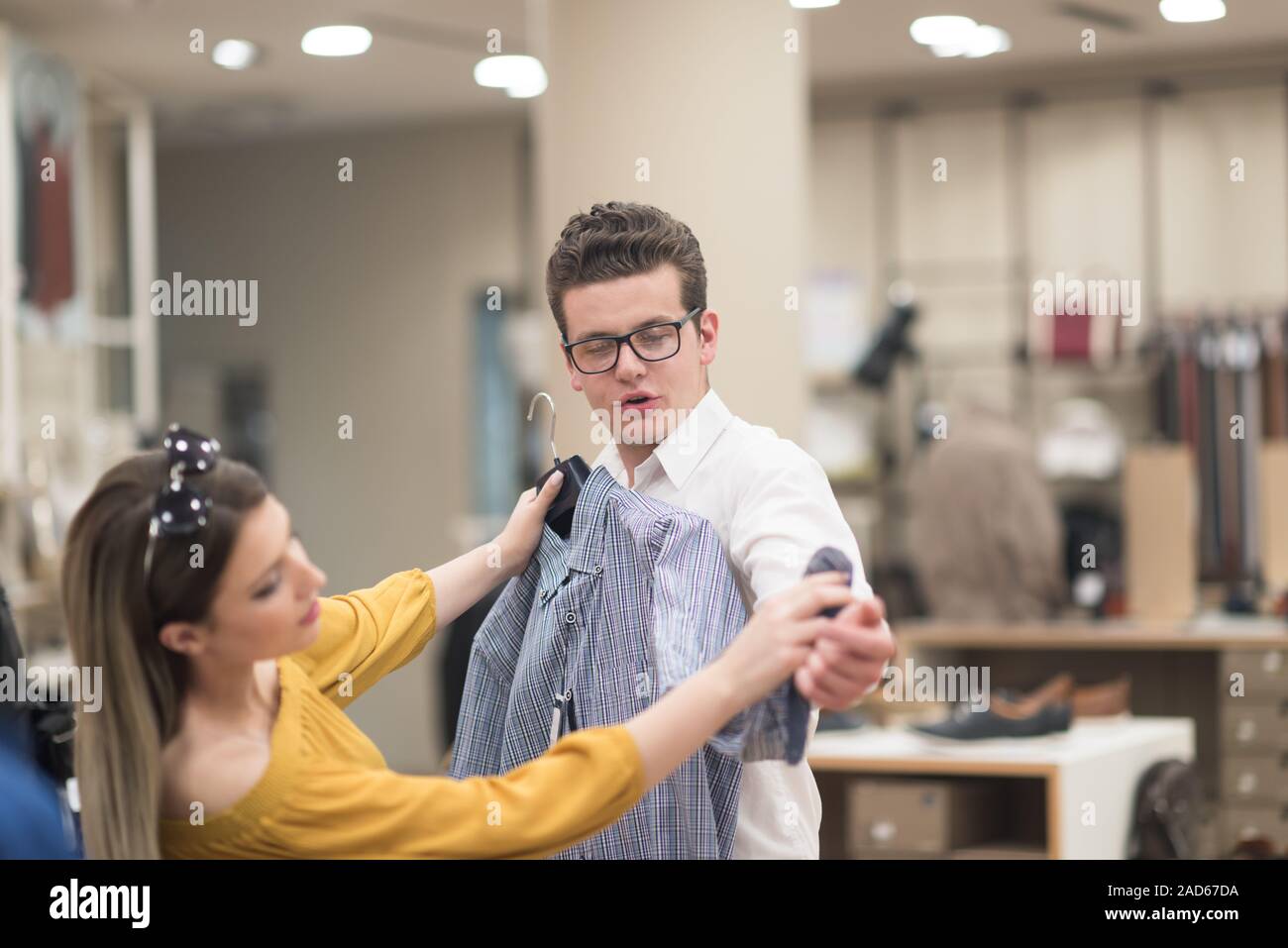 couple in Clothing Store Stock Photo - Alamy