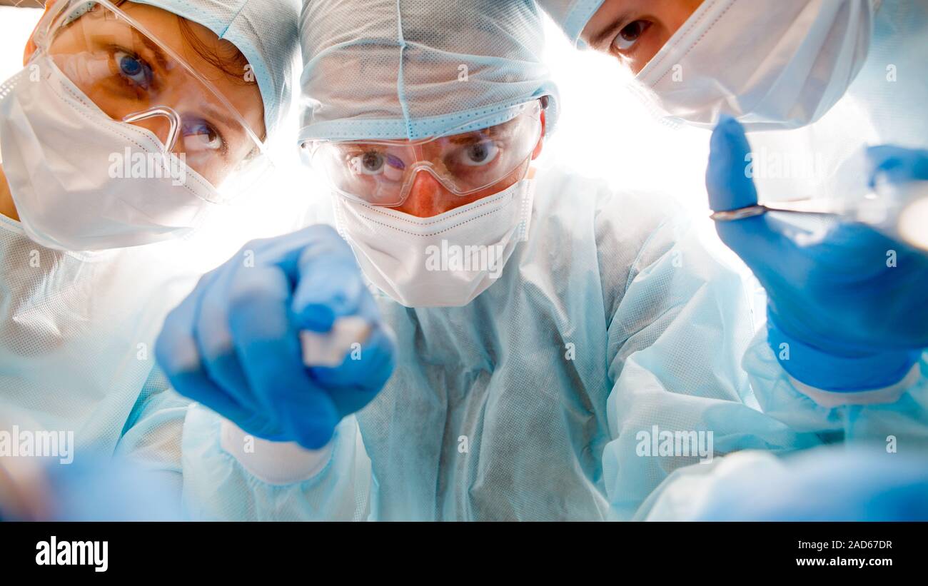 Team of surgeon in uniform Stock Photo - Alamy