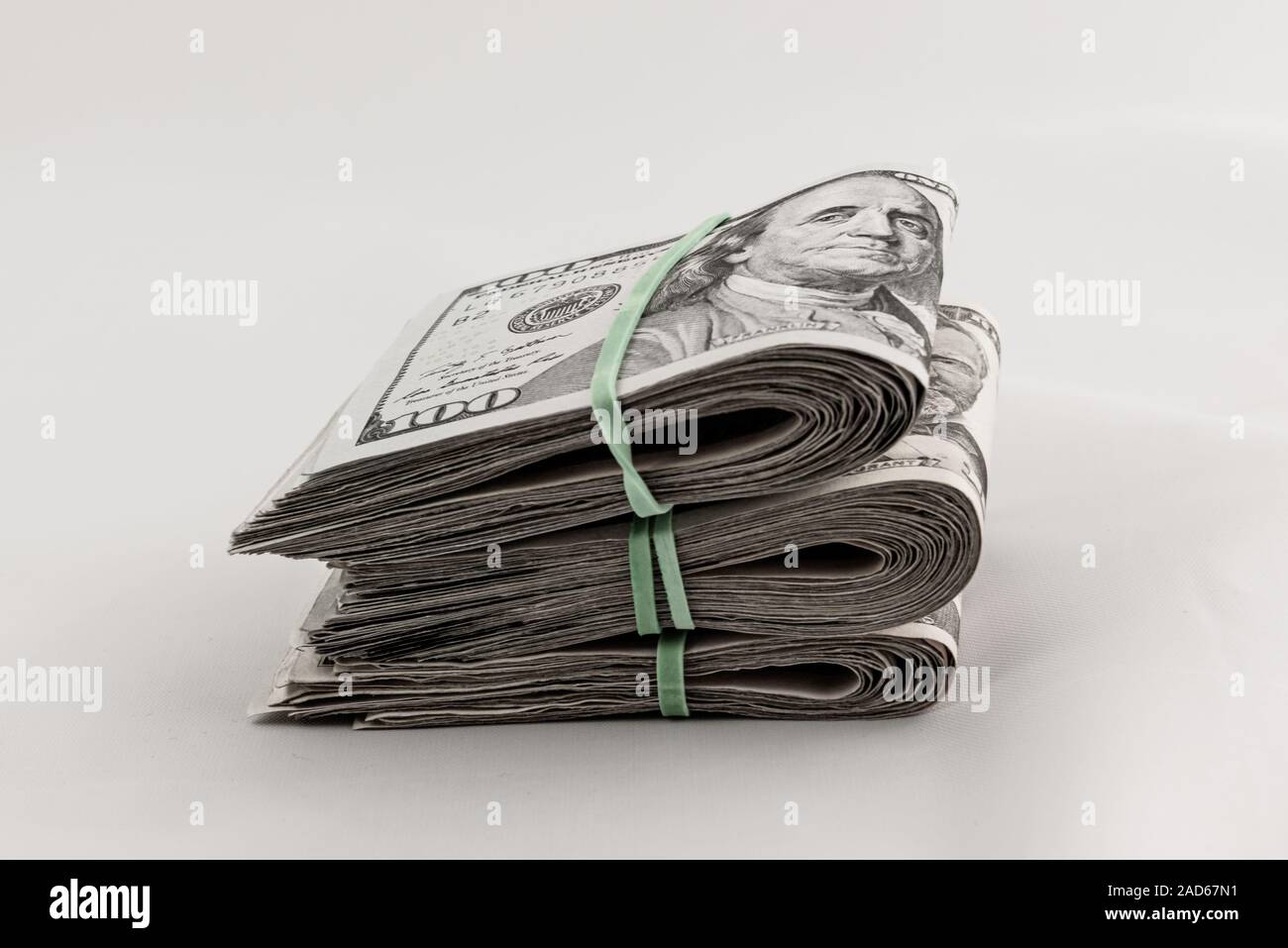 Stack of folded currency Stock Photo - Alamy