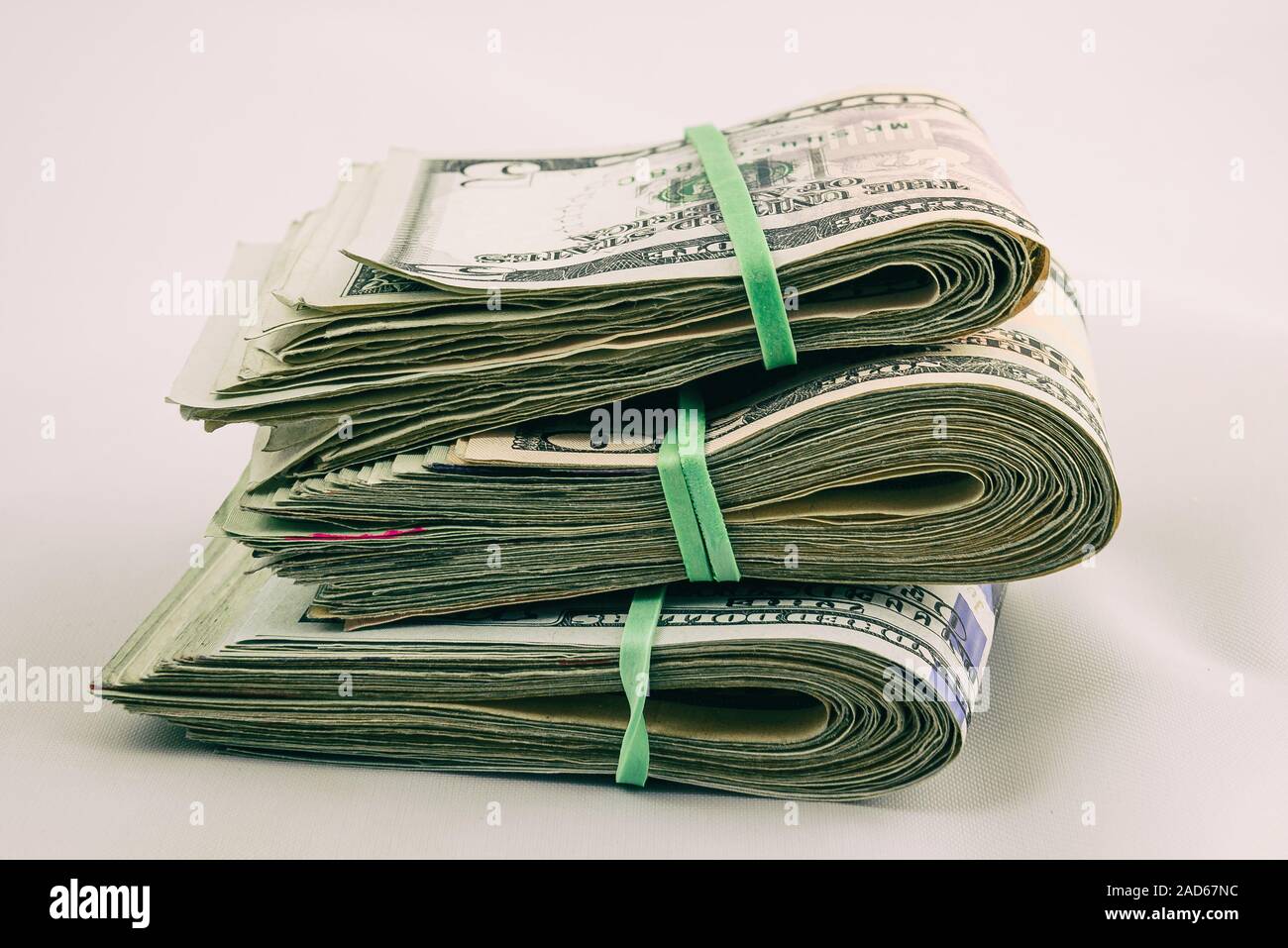 Stack of folded currency Stock Photo - Alamy