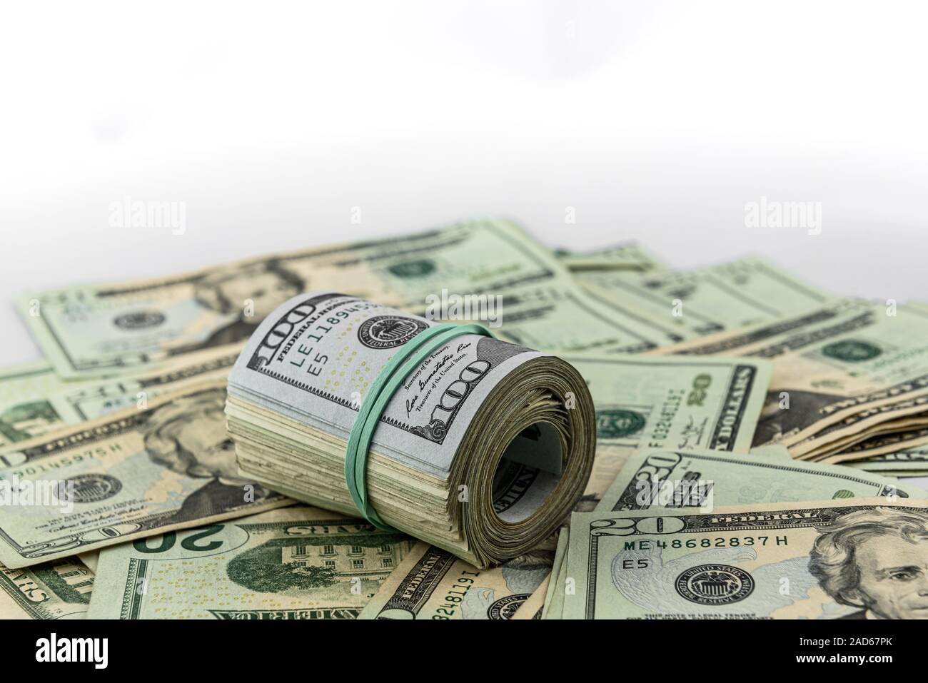 Roll of US Currency, a Bankroll, on a blanket of paper money Stock ...