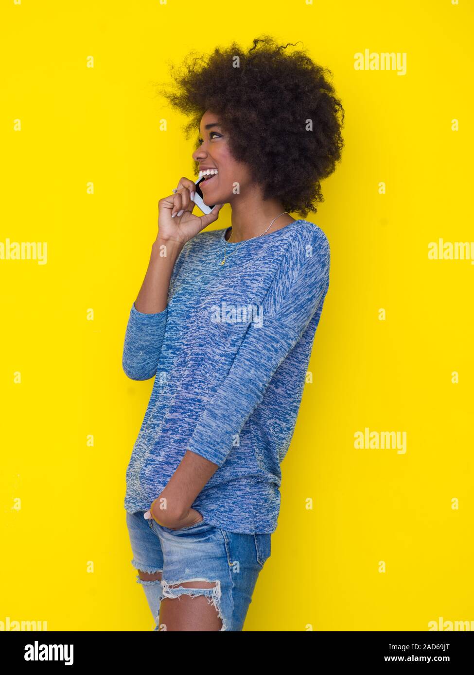 young black Woman Using mobile phone Stock Photo - Alamy