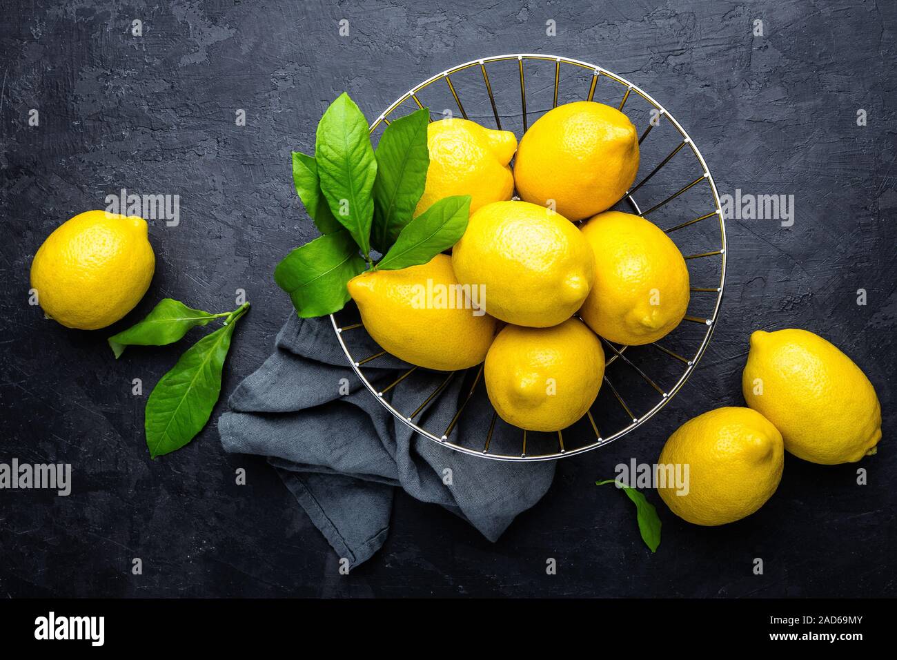 Lemons with leaves dark background hi-res stock photography and images ...