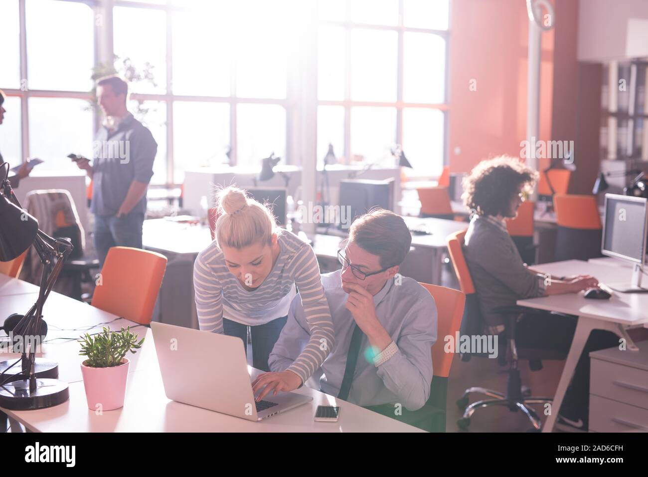 Two Business People Working With laptop in office Stock Photo - Alamy