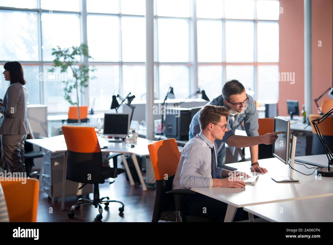 Two Business People Working With computer in office Stock Photo - Alamy