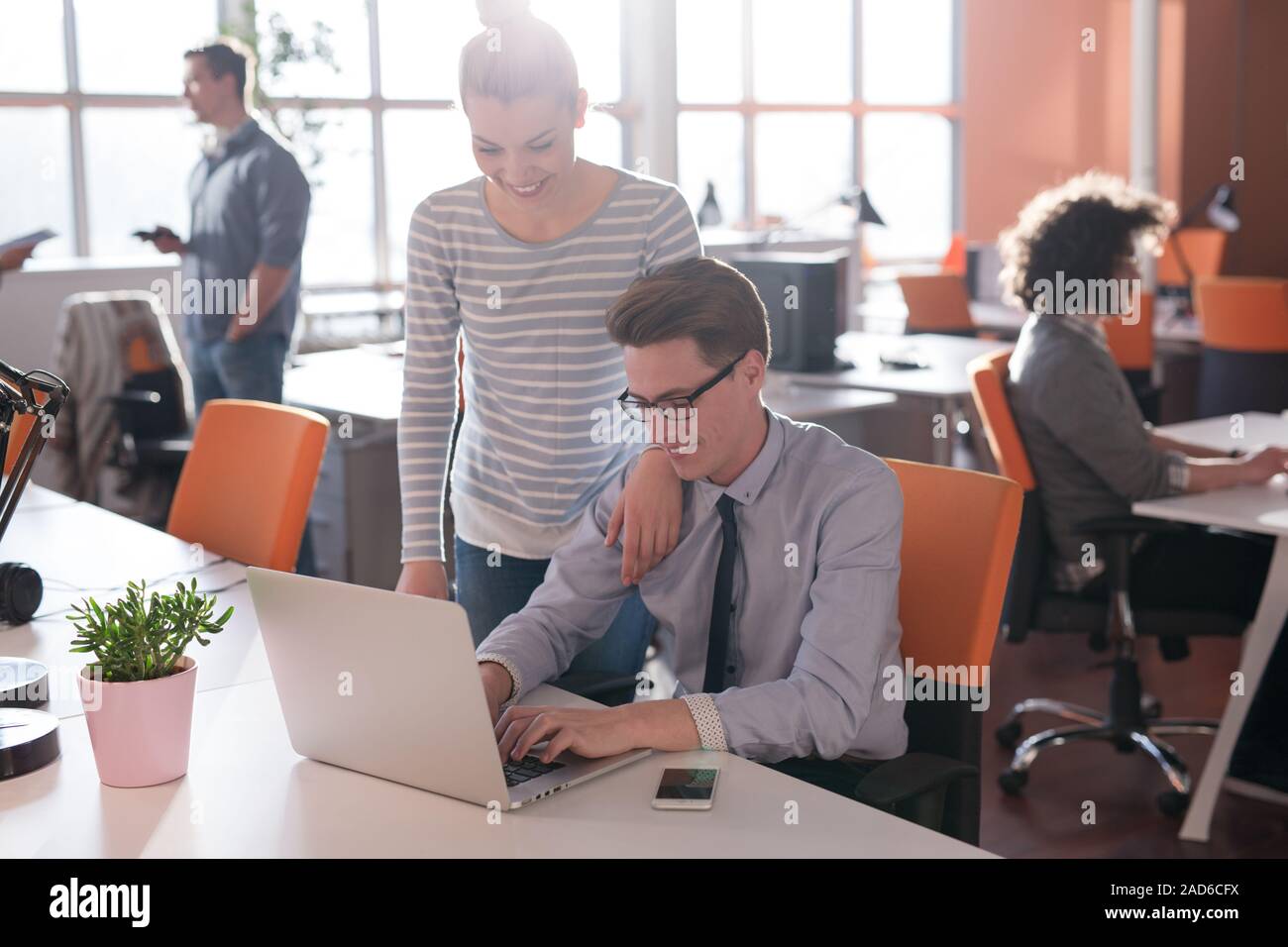 Two Business People Working With laptop in office Stock Photo - Alamy