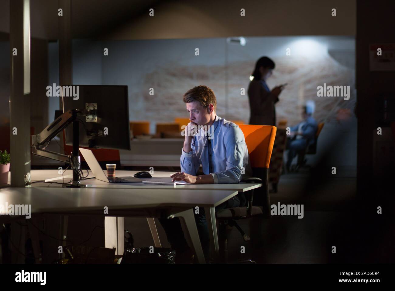 Business man in dark office hi-res stock photography and images - Alamy