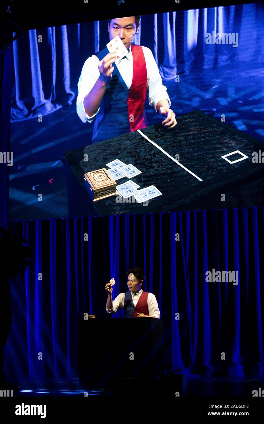 New York, USA. 3rd Dec, 2019. Illusionist Eric Chien performs during a ...